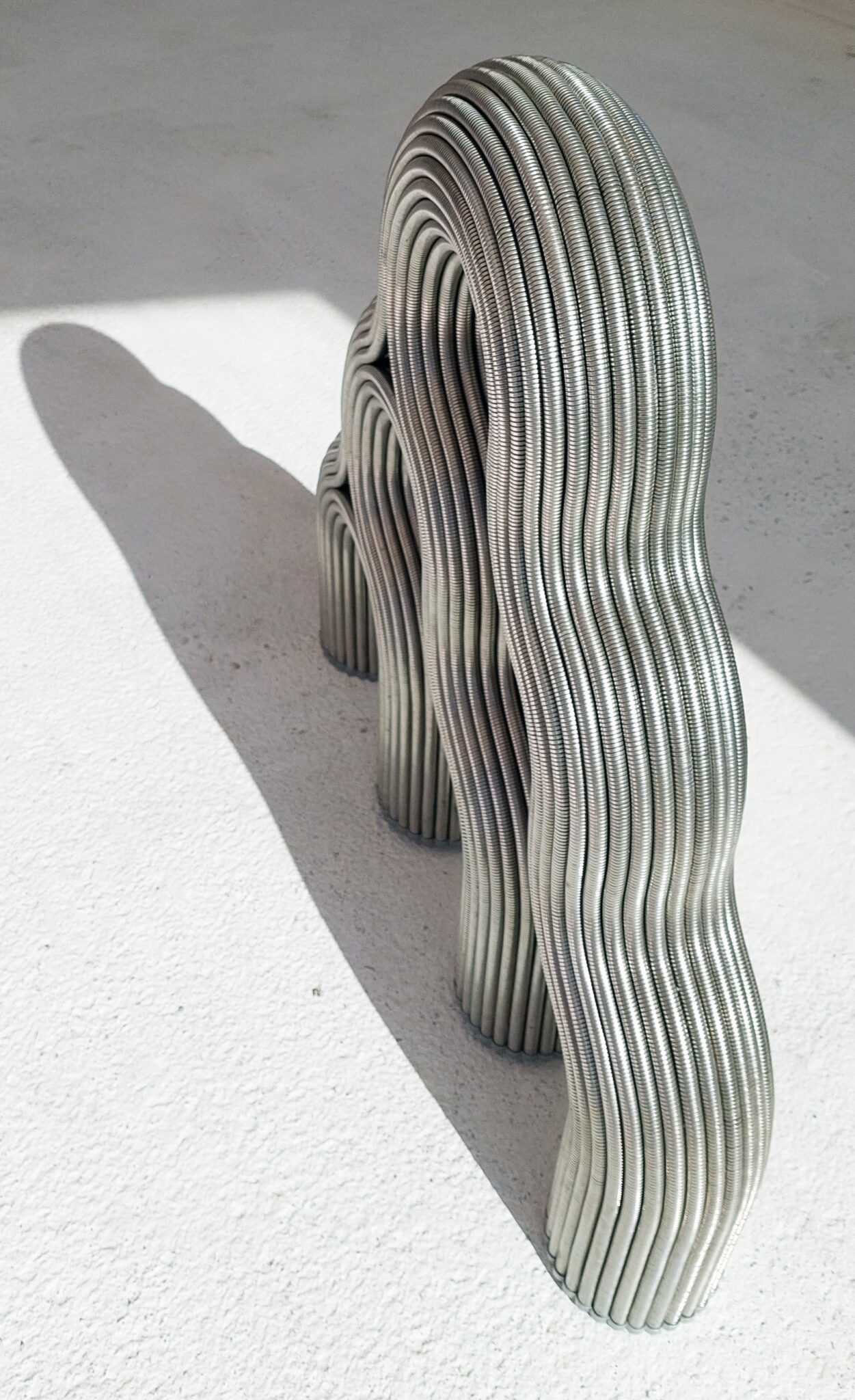 FLUXsculpture – Handcrafted Organic Steel Form Inspired by Nature’s Flow | designboom shop