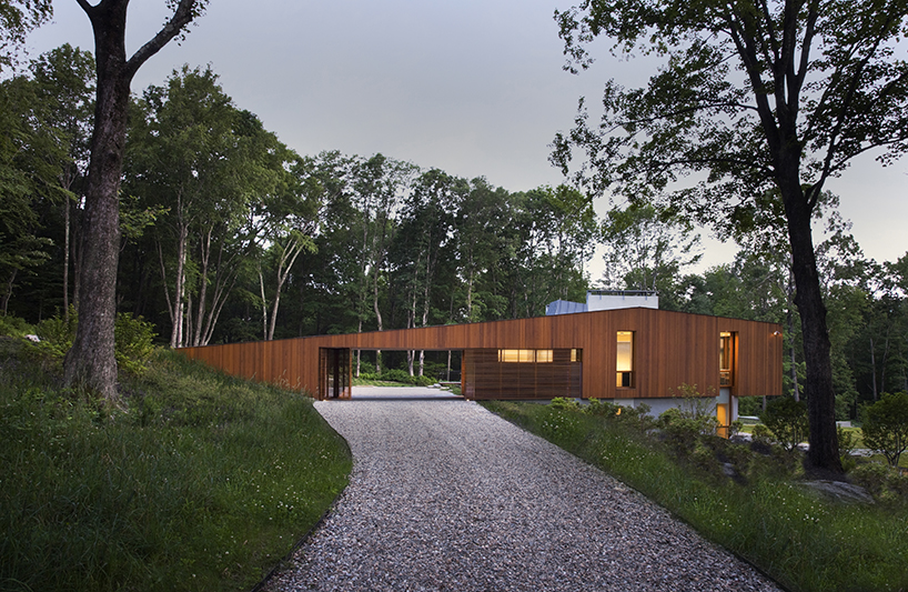 joeb moore + partners spans bridge house over landscape
