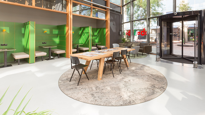 aat vos' new library has an inviting character with a high entrance and ...