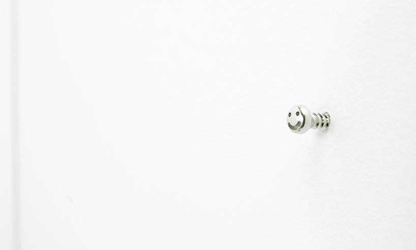 studio yumakano adds smiley face onto screws to bring joy