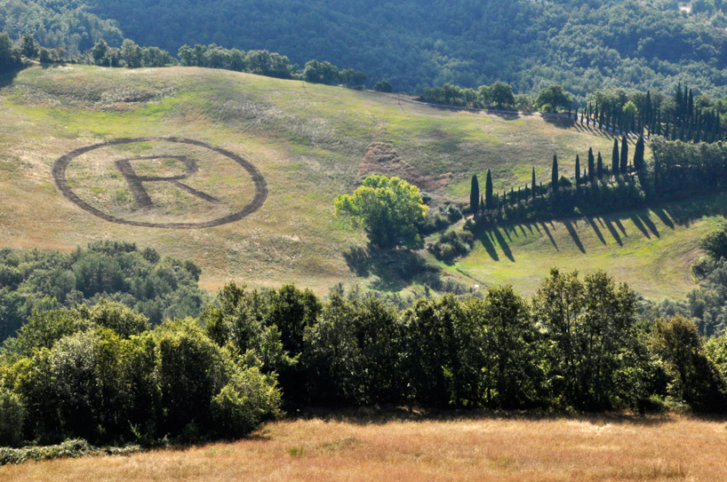 giuseppe licari cuts registered trademark into the tuscan countryside