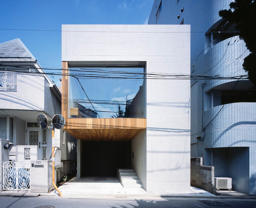 apollo architects arranges frame house around large window in tokyo