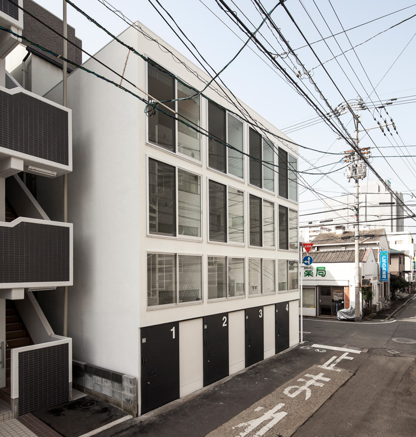 be fun design combines four narrow dwellings for spiral house in japan