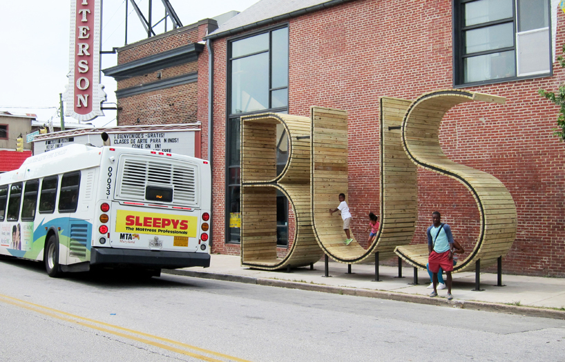 waiting for the BUS inside a giant typographic sculpture by mmmm...