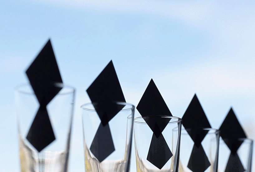 kyouei design forms minimal square wind bell from metal and glass