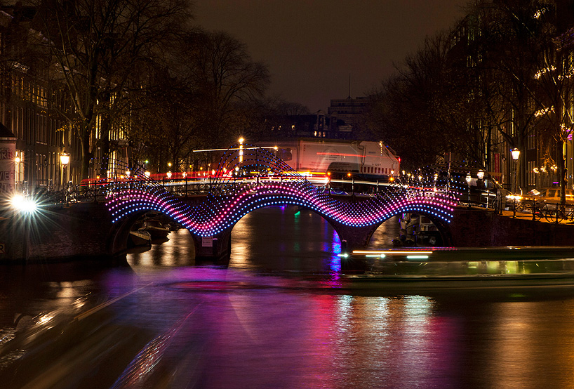 tjep. illuminates amsterdam's canals with undulating light bridge