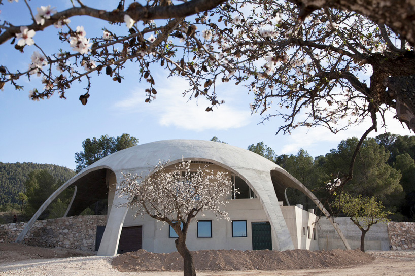 claudio hebberecht crafts artist's abode beneath concrete dome
