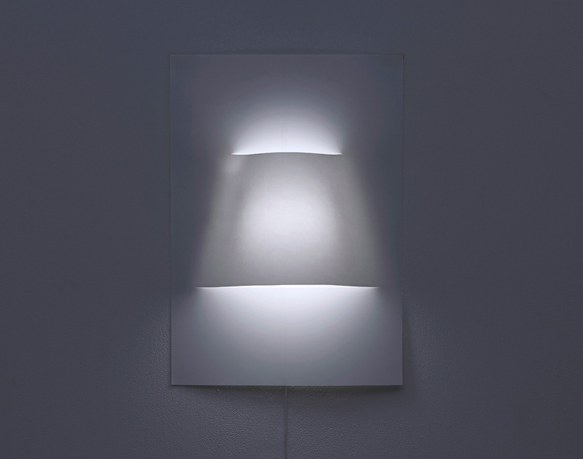YOY design studio forms poster lamp with a single sheet of paper