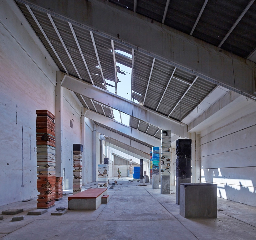 adrián villar rojas stacks mixed material columns at the sharjah biennial