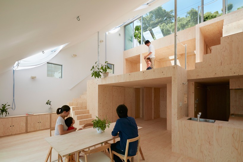 tomohiro hata's hillside house interior integrates terraced platforms