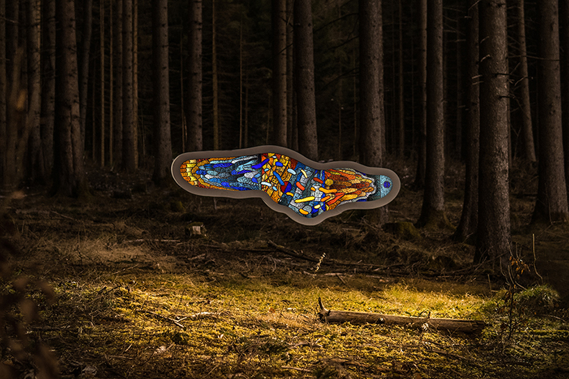 thomas medicus sets surreal stained glass amoeba sculpture in the woods