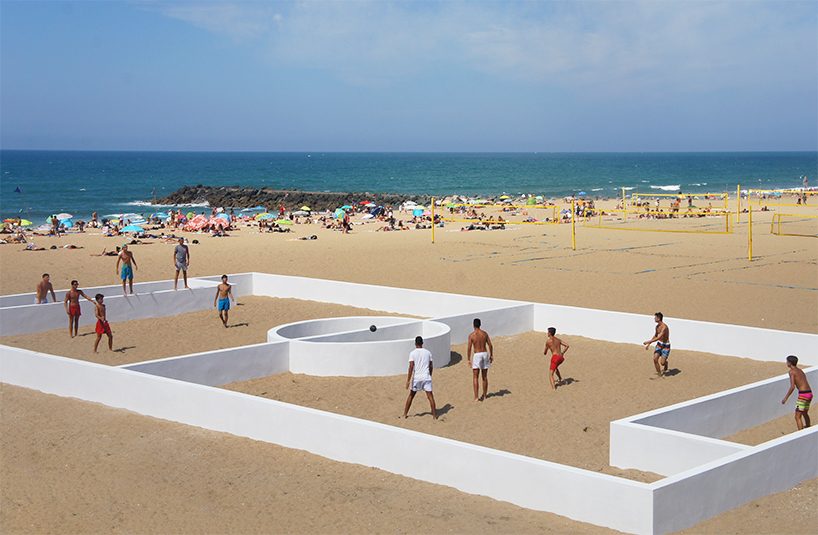 benedetto bufalino installs a walled football field on a beach in ...