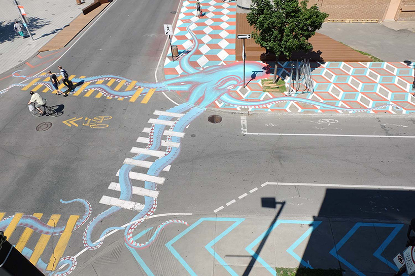 roadsworth adds to asphalt with surreal street art scenes