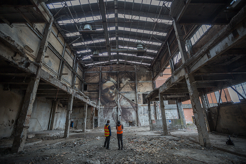 rone paints colossal portraits of women inside a paper mill days before ...
