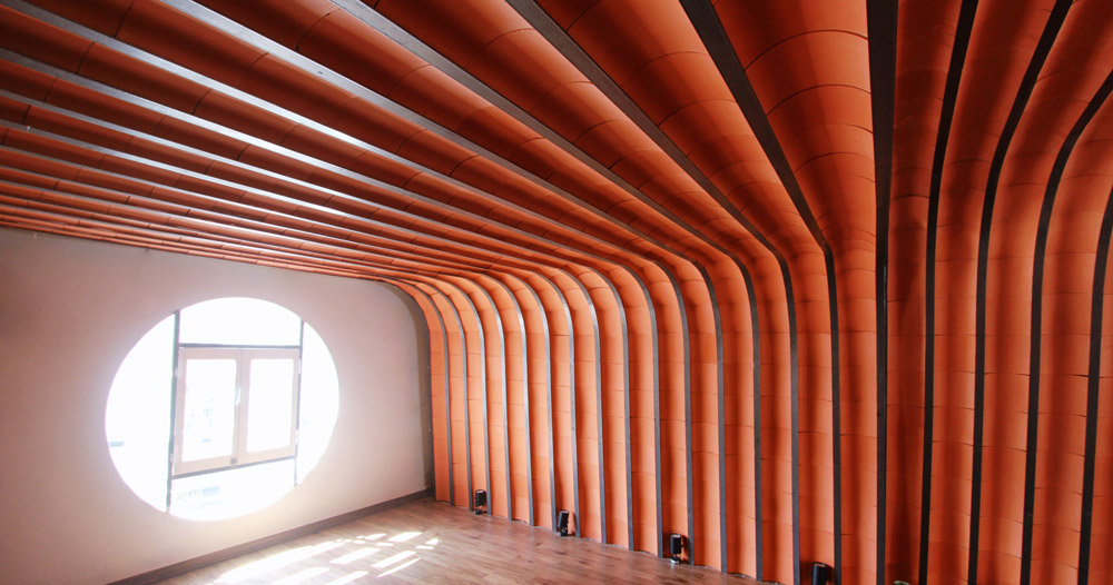 69.a StudiO clads yoga studio interior in vietnam with yin-yang tiles