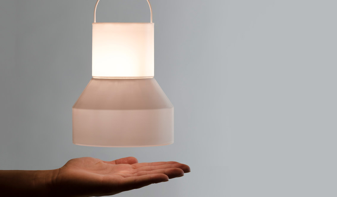 fabien roy's rocket nozzle-shaped lamp hovers right above you