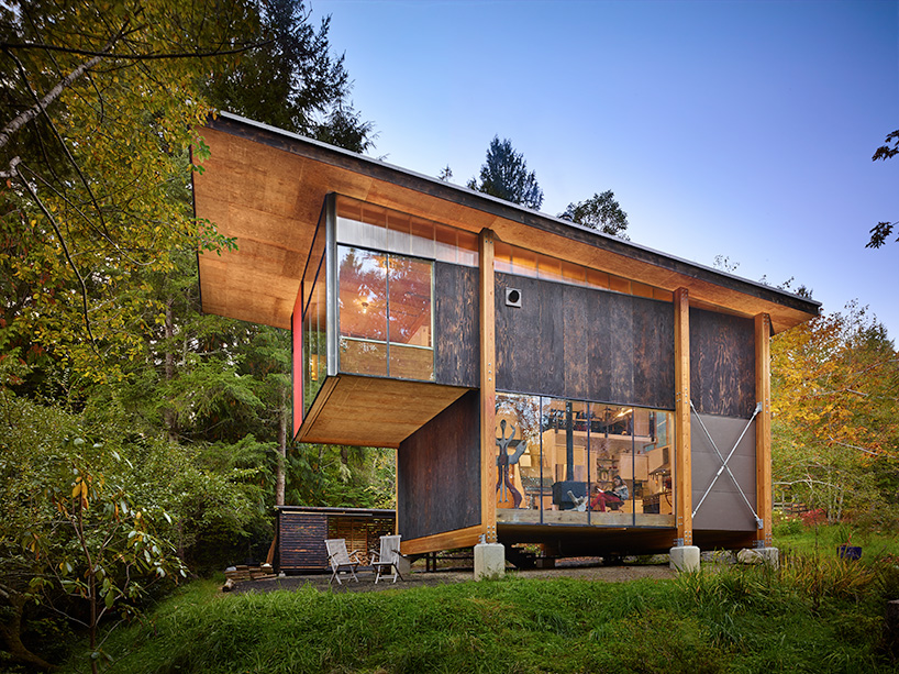 this sustainable forest studio was scavenged together
