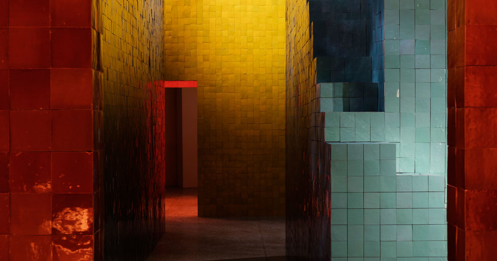 hermès presents new home collections within colorful, tile-clad chambers