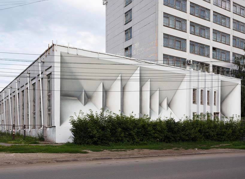 architectural-scale optical illusions recontextualize urban walls in russia