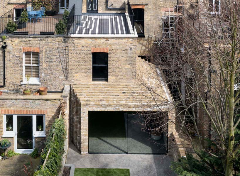 the step house 'elevates the humble brick' of this northlondon townhouse