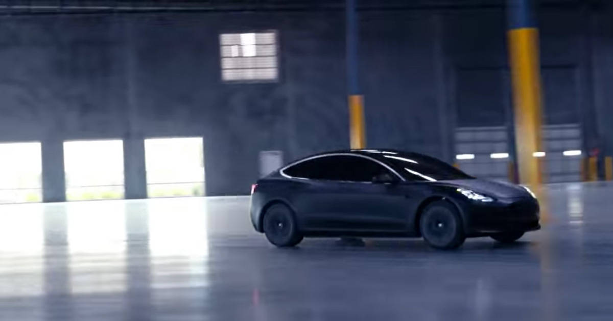 tesla teases mystery car in video featuring next-gen roadster in action