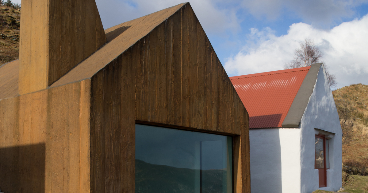 urban agency's rustic house is sheds covered with rusted metal