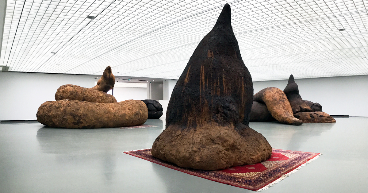 gelitin invites visitors to walk around giant turds in latest ...