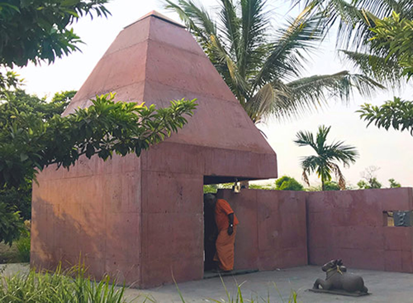 karan darda's orange hindu temple in india creates a contrast with ...