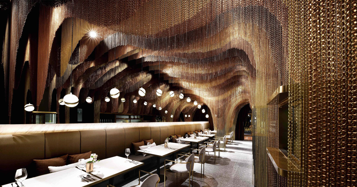 gold chains hanging from the ceiling of this tea house mimic the shape ...