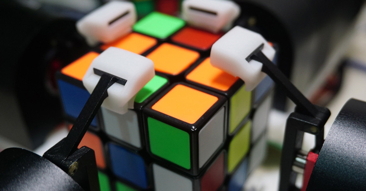 quad arm robot solves the rubik's cube in about three seconds quad arm robot solves the rubik's cube in about three seconds