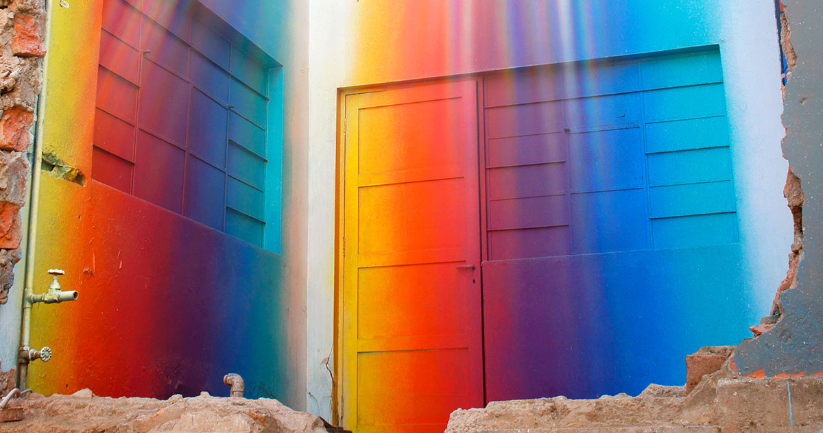 this building in lima is bathed in a spectrum of colorful hues