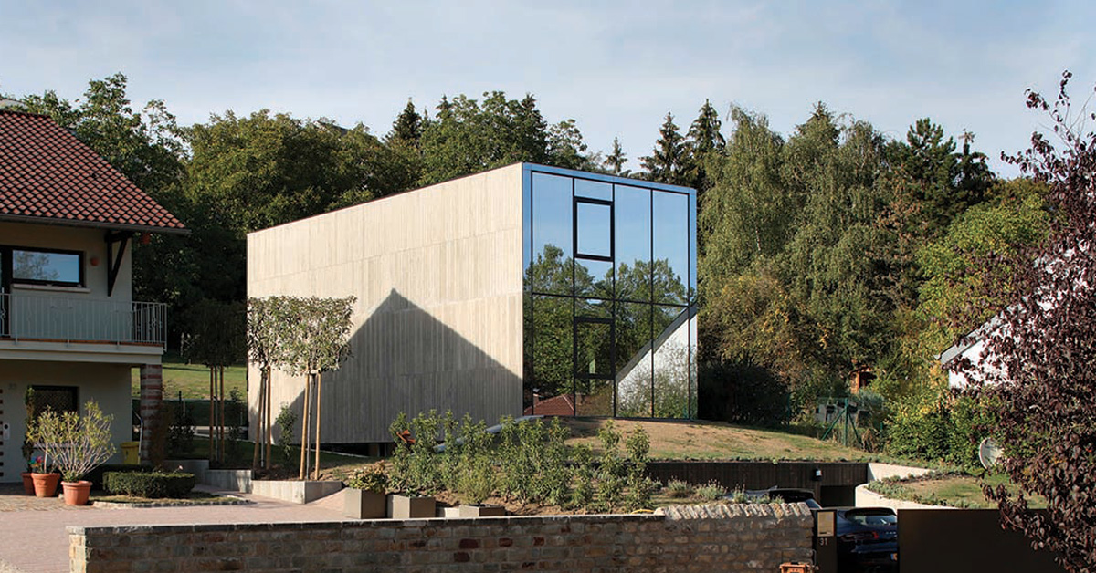 single-family house by 2001 juts like a concrete monolith from the ground