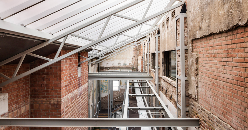 restoration by HARQUITECTES expresses heritage building's structural memory