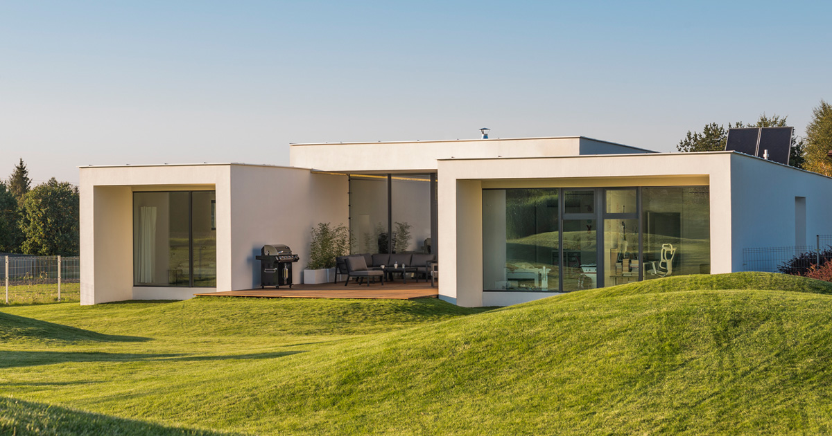 toprojekt's polish residence doubles as a barrier that blocks highway noise