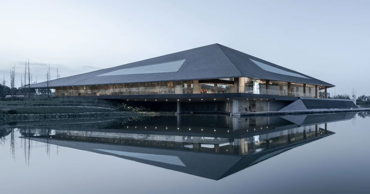 XAA's lakeside academy appears to float on water in meishan city, china