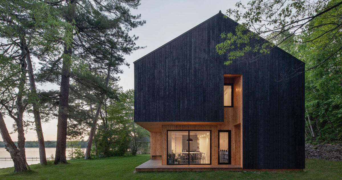 charred timber clads atelier schwimmer's lakeside chalet in quebec