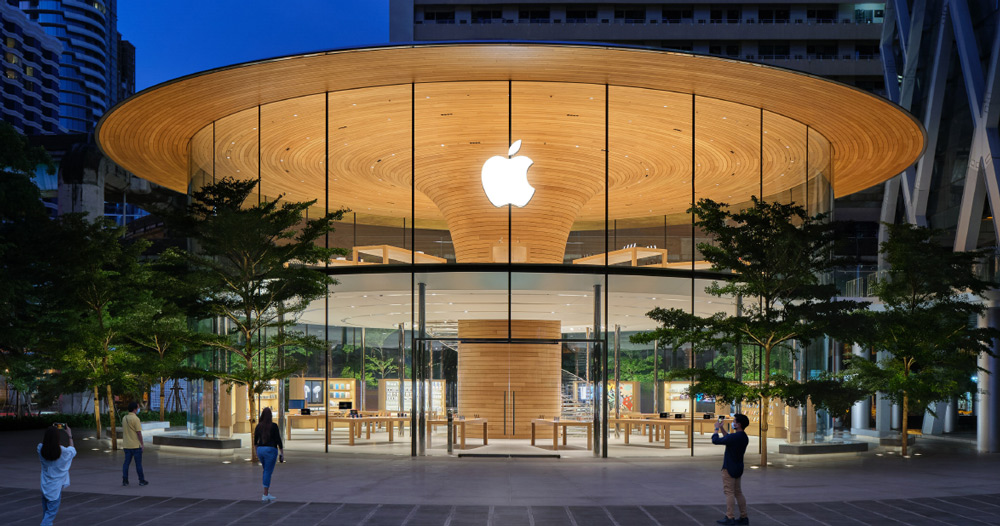'apple central world' in bangkok organized around tree canopy