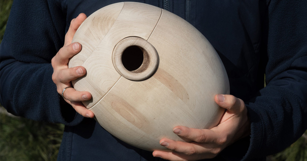 dydykin studio designs round wooden birdhouse to resemble a natural ...