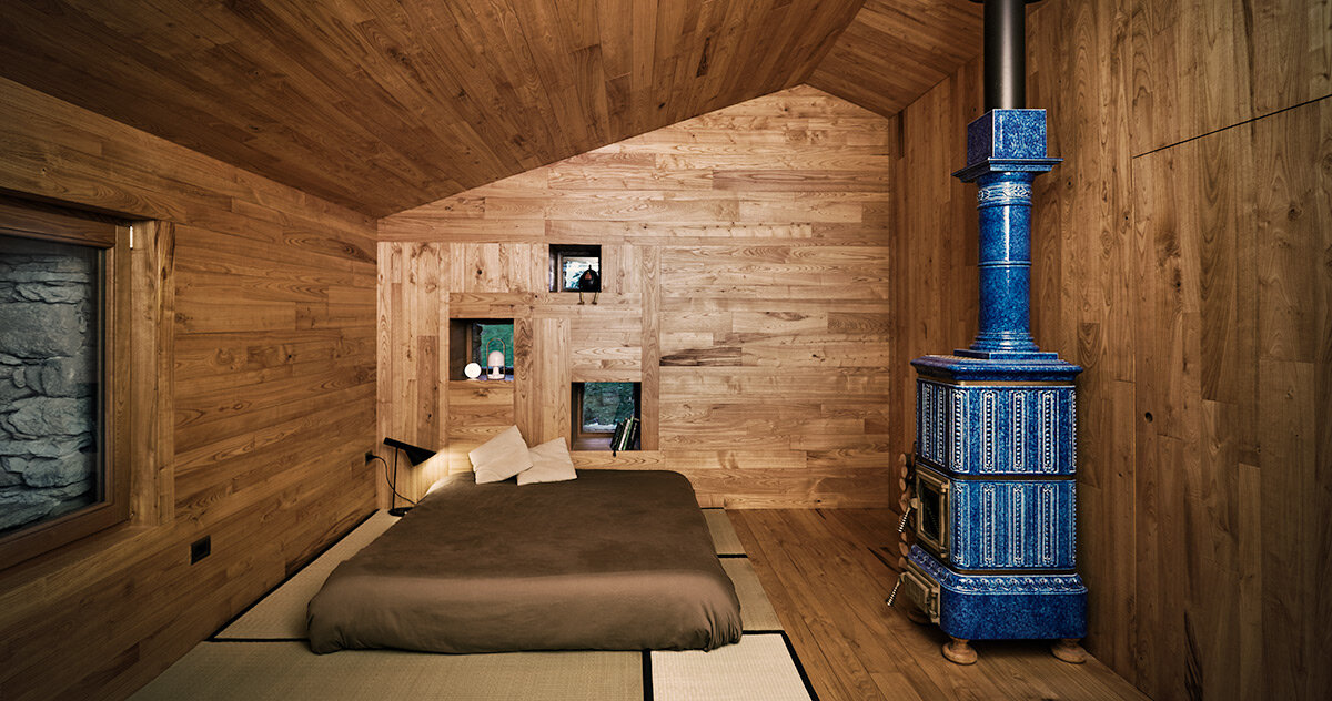 studioata restores stone hut in valle dell’orco with warm, chestnut ...