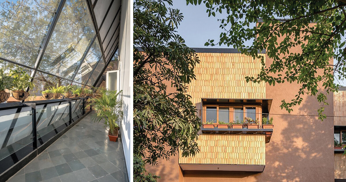 light-filled earthy colored home is cocooned in lush green garden in india