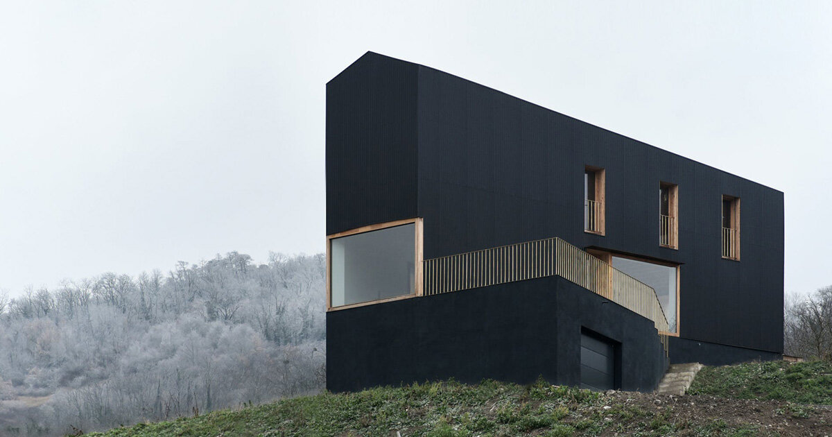 black corrugated metal clads récita architecture's slender house in france