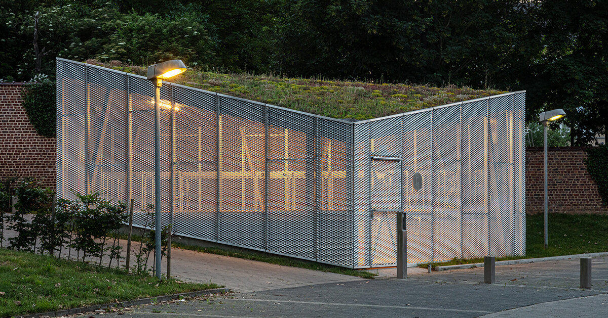 WAW architects builds bicycle pavilion wrapped in a mesh metal box