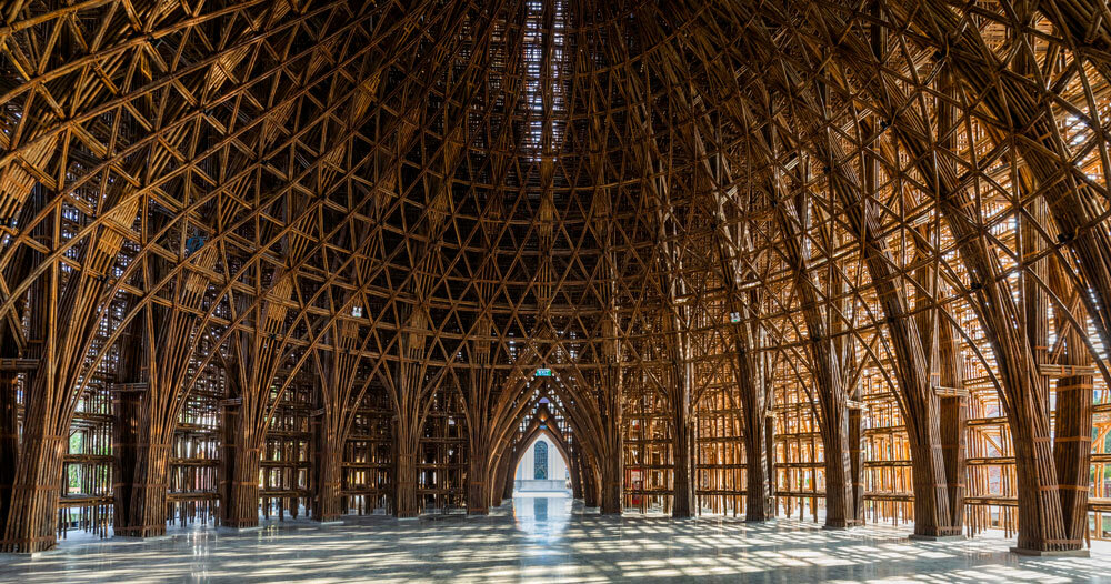 VTN architects carves out intricate bamboo center with sculptural vaulting