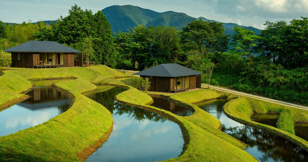 kengo kuma scatters hot spring hotel across sculpted rice terraces