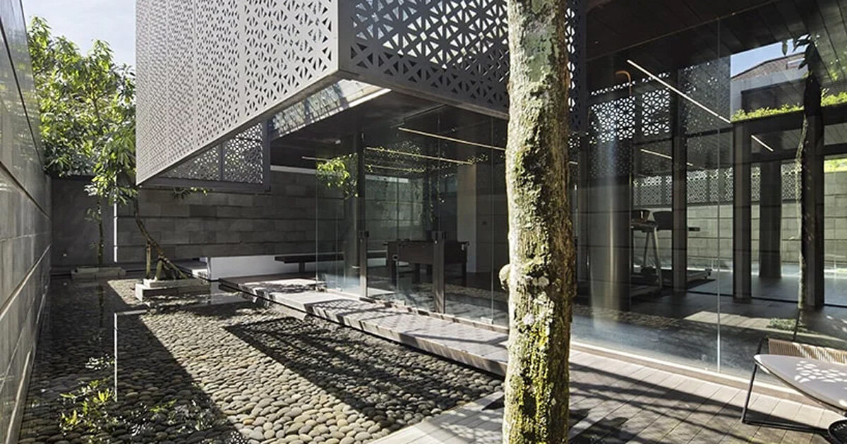 laser-cut aluminum facade defines 'golfn' residence in indonesia