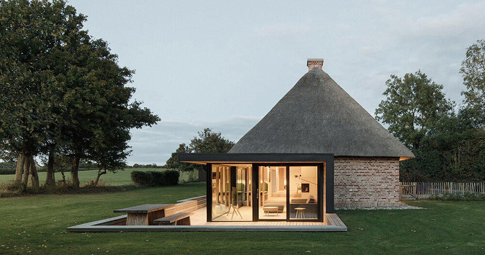 thatched brick 'nieby crofters cottage' revived with glass renovation