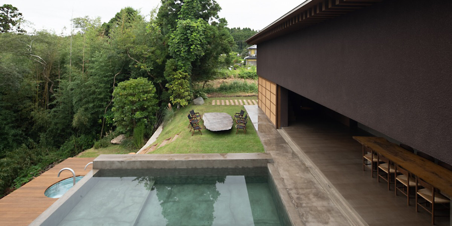 suppose design office nestles 'daichi isumi' along japanese river