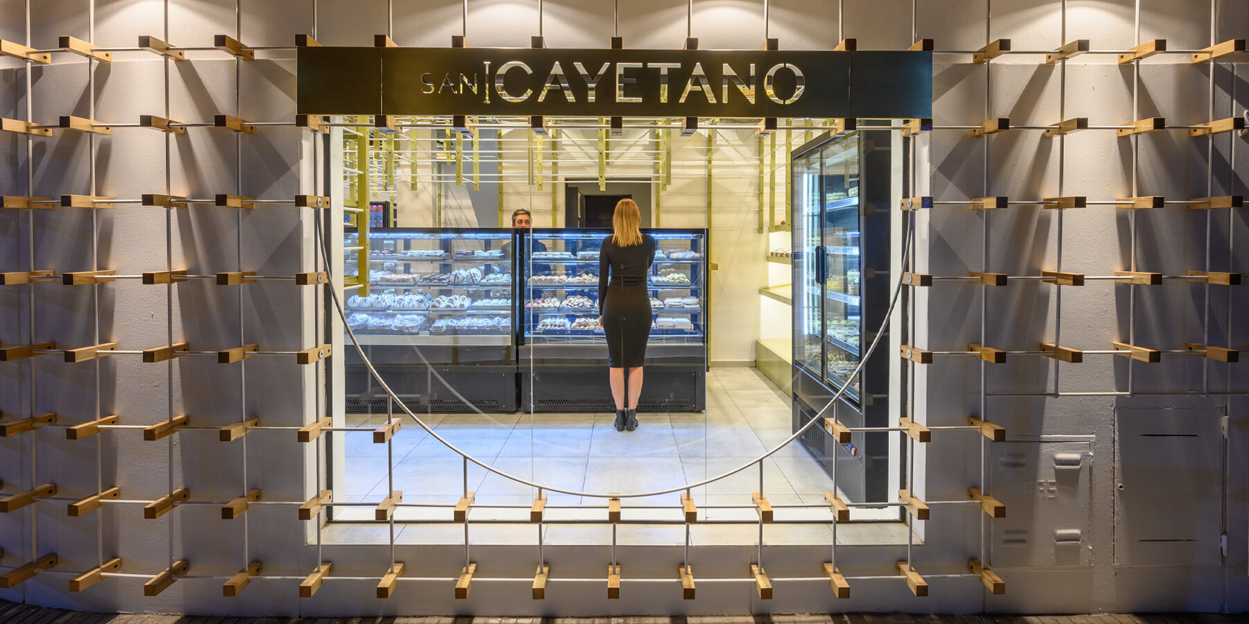 'san cayetano' bakery façade uplifted with iron and wooden props
