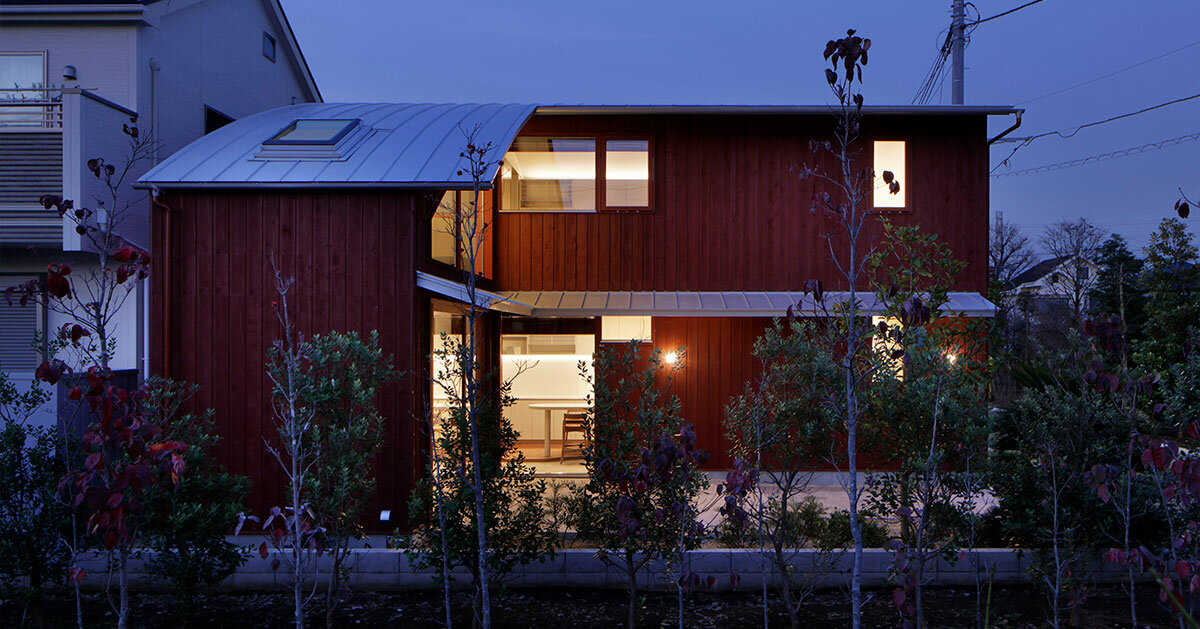 topped with a silver roof, deep red exterior clads CASE-REAL's wooden ...