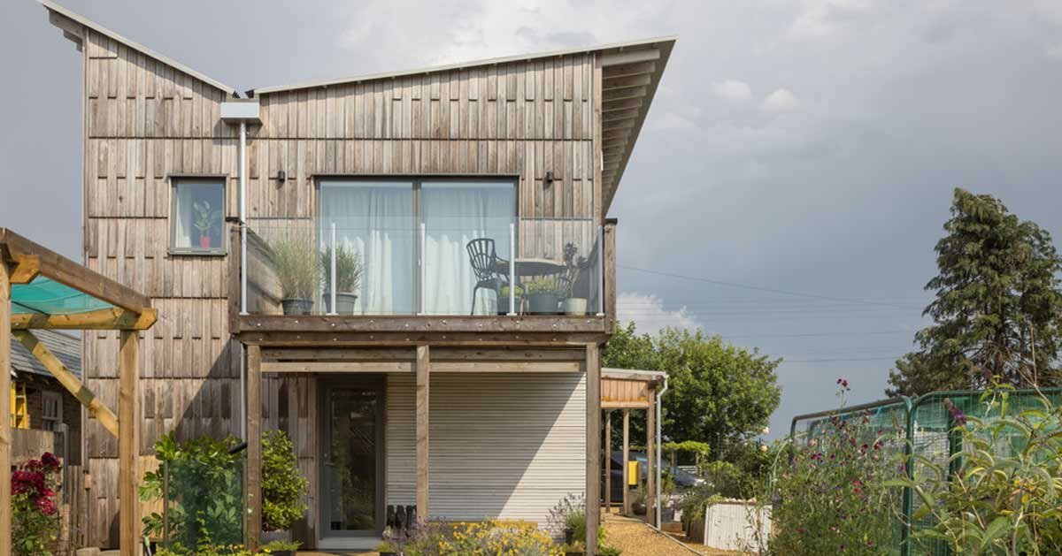 inverted gable roof unfolds on mole architects’ passivhaus in UK
